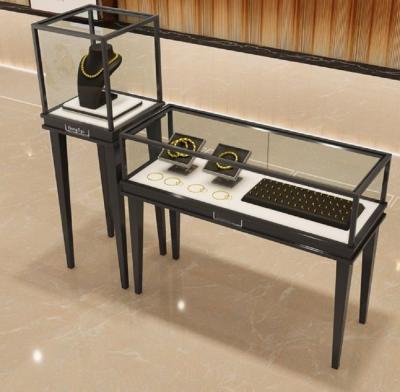 China Minimalist Luxury Jewelry Display Table Set High End Custom Showcase Glass Top Metal Frame LED Luxury Retail Premium Modern for sale