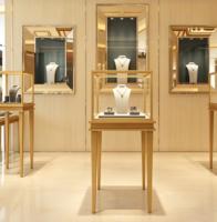 China Customized Item Shape Jewelry Display Table with Rust-proof Gold Metal Frame and High-Security Locks for sale