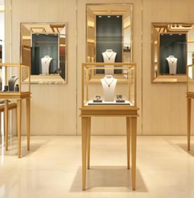 China Customized Item Shape Jewelry Display Table with Rust-proof Gold Metal Frame and High-Security Locks for sale