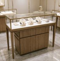 China Freestanding Island Display Cabinet with Tempered Glass Top, Lockable Glass Doors, and Customizable Modular Layout for sale