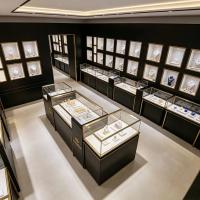 China Natural Marble Base Upright Display Case with Integrated LED Lighting and Adjustable Glass Shelves for sale
