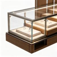 China 25kg Jewelry Display Table with Rust-proof Gold Metal Frame, Tempered Glass Shelving, and Velvet Lined Drawer for Secure Jewelry Showcase for sale