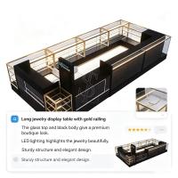 China Matte Black Stainless Steel Wall Mounted Display Case with Built-in High CRI LED Lighting and Adjustable Glass Shelves for sale