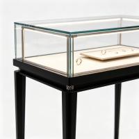 China Matte Black Stainless Steel Wall Mounted Display Case with Energy LED Lighting and Solid Back Construction for sale