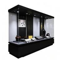China Matte Black Stainless Steel Wall Mounted Display Case with Adjustable Glass Shelves and Dustproof Secure Protection for sale