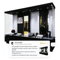 China Matte Black Stainless Steel Wall Mounted Display Case with Adjustable Glass Shelves and Dustproof Secure Protection for sale