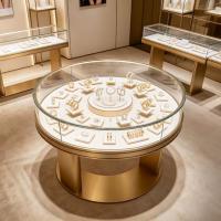 China Freestanding Island Display Cabinet with Dimmable LED Lighting System, Lockable Glass Doors, and Curved Central Showcase for sale