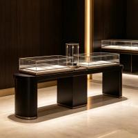 China Freestanding Island Display Cabinet with Curved Glass Dimmable Brightness and Lockable Glass Doors for sale
