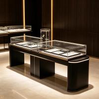 China Freestanding Island Display Cabinet with Curved Glass Dimmable Brightness and Lockable Glass Doors for sale