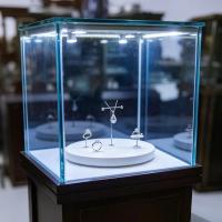 China Built-in Dimmable LED Lighting Jewelry Display Table with High-Security Locks and Matte White Exterior Finish for sale