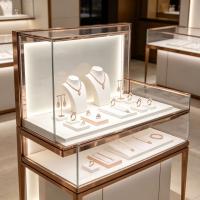 China 12 Compartments Jewelry Display Table with High-Security Locks and Matte White Exterior Finish for sale