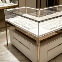 China 12 Compartments Jewelry Display Table with High-Security Locks and Matte White Exterior Finish for sale