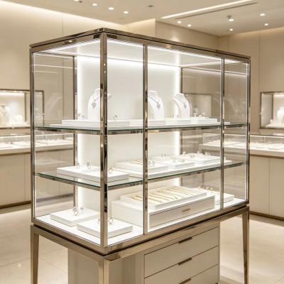 China 12 Compartments Jewelry Display Table with High-Security Locks and Matte White Exterior Finish for sale