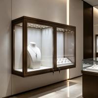 China Champagne Gold Jewelry Shop Design with 1.1 CBM Volume Display Case and 12V Output Voltage Shatter-resistant Tempered Glass for sale