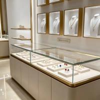 China Lockable Drawer Jewelry Display Table with 12 Compartments and Tempered Glass Shelving for sale