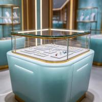 China Dark Bronze Frame Island Display Cabinet with Built-in LED Lighting and Lockable Glass Doors for sale