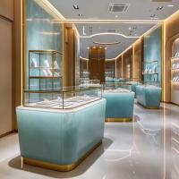 China Dark Bronze Frame Island Display Cabinet with Built-in LED Lighting and Lockable Glass Doors for sale