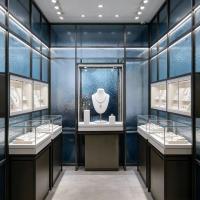 China Luxury Jewelry Store Layout with Full-length Mirrors Near Display, Polished Marble Flooring, and Backlit Logo Sign for sale