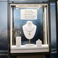 China Luxury Jewelry Store Layout with Full-length Mirrors Near Display, Polished Marble Flooring, and Backlit Logo Sign for sale