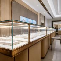 China Customized Upright Display Case with Black Powder Coated Finish Sliding Glass Doors and Adjustable Glass Shelves for sale