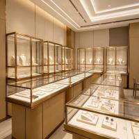 China Customized Upright Display Case with Black Powder Coated Finish Sliding Glass Doors and Adjustable Glass Shelves for sale