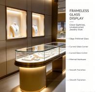 China Freestanding Island Display Cabinet with Adjustable Glass Shelves and Reinforced Metal Frame Featuring Built-in LED Lighting for sale