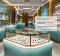 China Exclusive Jewelry Retail Space with Textured Wallpaper and LED Spotlights in White and Gold Color Scheme for sale