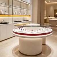 China Modern Jewelry Shop Design with White and Gold Color Scheme Aluminium Frame and Polished Marble Flooring for sale
