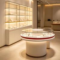 China Modern Jewelry Shop Design with White and Gold Color Scheme Aluminium Frame and Polished Marble Flooring for sale