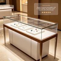 China White And Gold Color Scheme Modern Jewelry Shop Interior with Textured Wallpaper and LED Spotlights for sale
