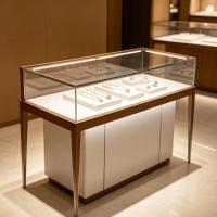 China White And Gold Color Scheme Modern Jewelry Shop Interior with Textured Wallpaper and LED Spotlights for sale