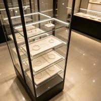 China Tempered Glass Jewelry Display Table with Lockable Compartments and Dimmable High-CRI LED Lighting for sale