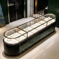 China Secure Key Lock Jewelry Counter with Hidden LED Strip Lighting and Marble Tabletop for Elegant Jewelry Display for sale