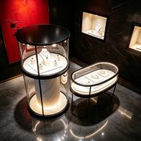 China Wooden Jewelry Display Counter with Secure Key Lock Marble Tabletop and Hidden LED Strip Lighting for sale