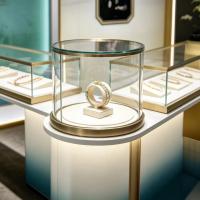 China Waterproof Island Display Cabinet with Round Island Design and Built-In Storage Drawers for Commercial Spaces for sale