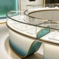 China Waterproof Island Display Cabinet with Round Island Design and Built-In Storage Drawers for Commercial Spaces for sale