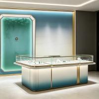 China Waterproof Island Display Cabinet with Round Island Design and Built-In Storage Drawers for Commercial Spaces for sale