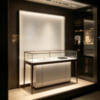 China Freestanding Island Display Cabinet with Brushed Champagne Gold Metal Finish and 360° Panoramic Display in Museum-Grade Construction for sale