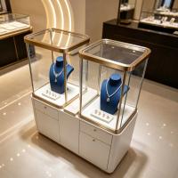 China Jewelry Display Table with Velvet Lined Drawers, Built-in Dimmable LED Lighting, and Rust-proof Gold Metal Frame for sale