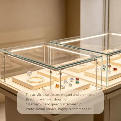 China Solid Wood Island Display Cabinet with Stainless Steel Durable Base and Curved Island Design for Retail Spaces for sale