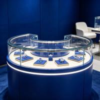 China Waterproof Curved Island Display Cabinet with Stainless Steel Durable Base for Retail Spaces for sale