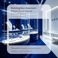 China Waterproof Curved Island Display Cabinet with Stainless Steel Durable Base for Retail Spaces for sale