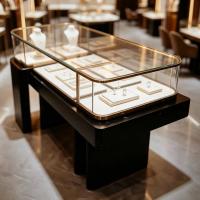 China Jewelry Shop Design with Ample Hidden Cabinets and Calacatta Marble Top in White and Gold Color Scheme for Jewelry Store Interior for sale
