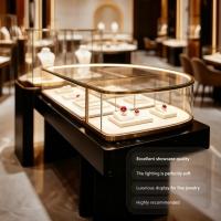 China Jewelry Shop Design with Ample Hidden Cabinets and Calacatta Marble Top in White and Gold Color Scheme for Jewelry Store Interior for sale