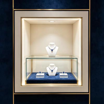 China Calacatta Marble Top Jewelry Shop Design with Ambient and Accent Lighting and Ample Hidden Cabinets for Jewelry Store Layout for sale