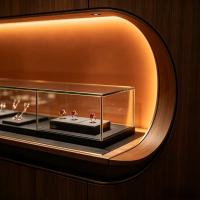 China Customized Jewelry Shop Design and Jewelry Store Layout with Calacatta Marble Top, Ample Hidden Cabinets and White and Gold Color Scheme for sale