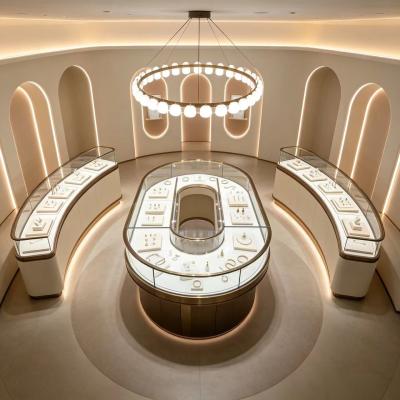 China Aluminium Frame Material Jewelry Shop Design with Calacatta Marble Top and Large Secure Cabinets for Jewelry Store Layout for sale
