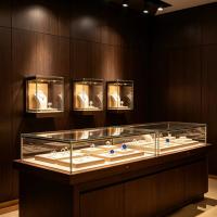 China Gold Glass Jewelry Shop Design with Calacatta Marble Top and Interactive Digital Displays for Modern Jewelry Store Layout for sale