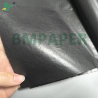 China 30gsm Single Side Glossy Black Paper For Fruit Protection Bag Inner Layer for sale