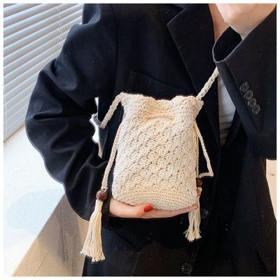 China Hot Sale Women Hollow Out Crochet Knit Summer Handbags Straw Woven Portable Raffia Beach Holiday Tote Bag Raffia Paper Rope Crochet Straw Bag for Seaside Vacation Trips Shopping and Shopping for sale